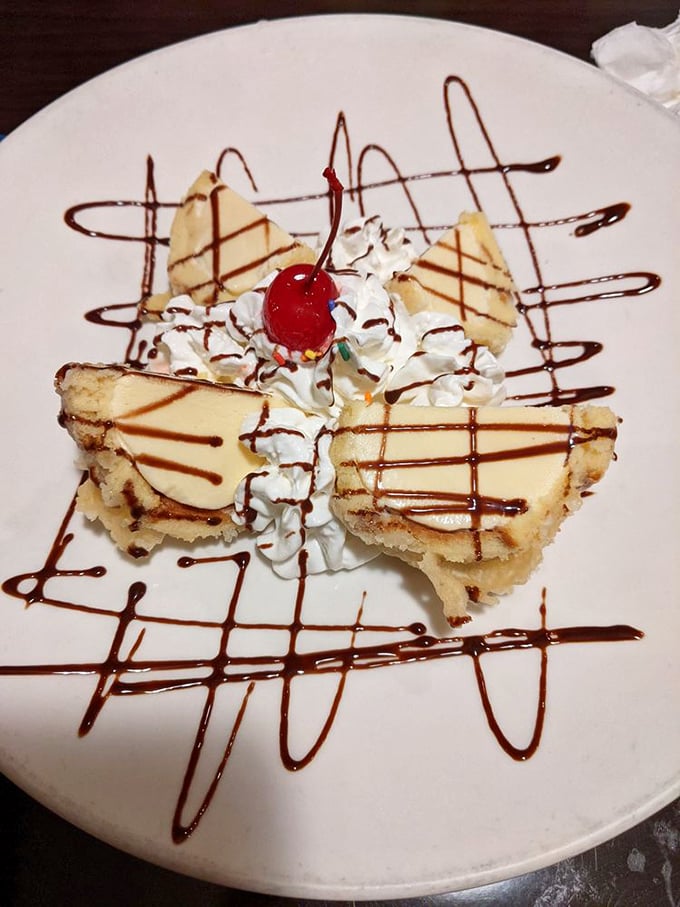 Behold the star attraction! Yukon's fried ice cream arrives like edible architecture – crispy exterior, cold creamy center, and artistic chocolate drizzles worthy of a gallery opening.