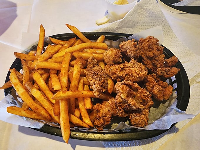 Golden-brown nuggets of happiness paired with crispy fries. These aren't just fried oysters—they're edible proof that perfection exists in this world.
