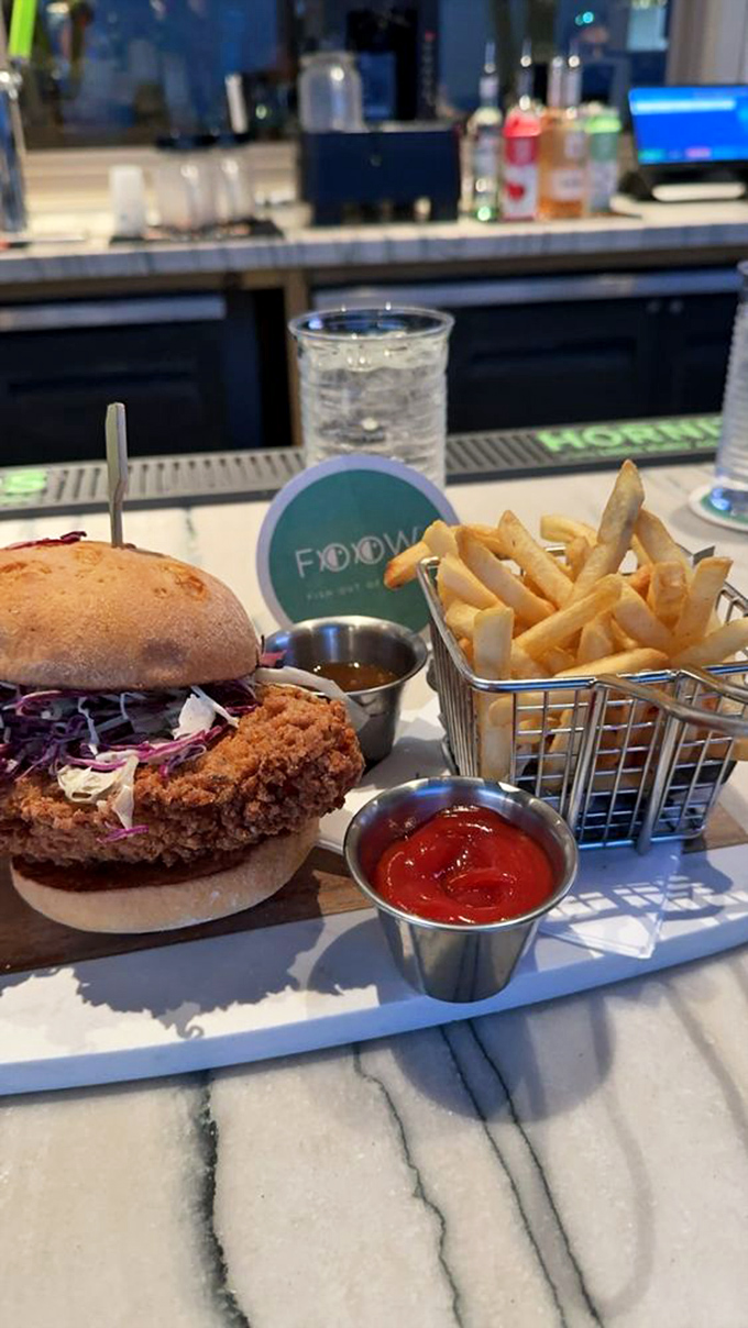 The fried chicken sandwich that makes you forget you came here for seafood – gloriously golden and perfectly crispy.