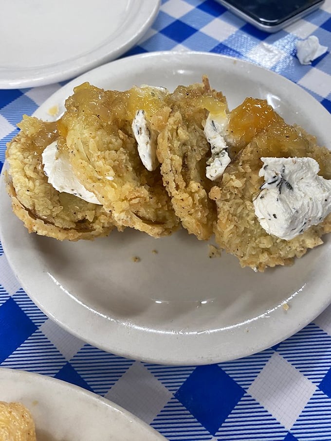 Golden-crusted fried green tomatoes that make you understand why people write songs about Southern cooking. The perfect balance of tang and crunch.