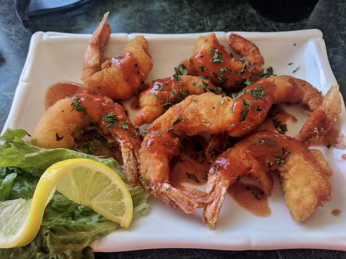 These fried shrimp aren't just golden—they're wearing the kind of crispy coating that makes you wonder if you should have ordered a double portion right from the start.