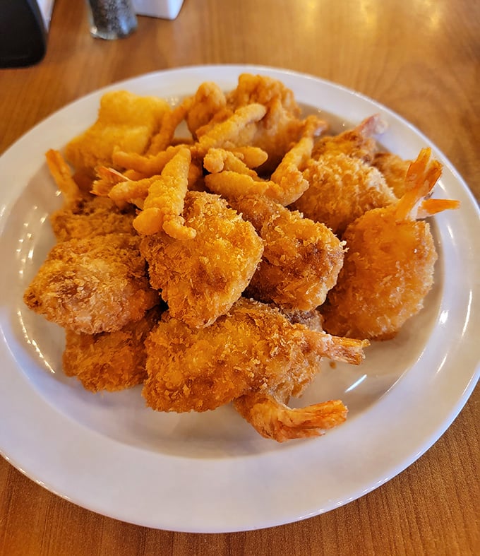 Golden-battered shrimp piled high like delicious treasure – this plate is why elastic-waist pants were invented for buffet expeditions.