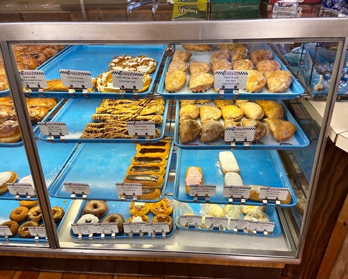 Blue trays loaded with golden treasures await behind glass—like a museum exhibit dedicated to the art of "How to Make People Happy."