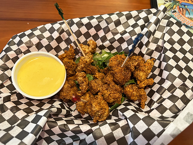 Gator bites arrive golden and crispy, served with a sunny dipping sauce. It's the ultimate Florida handshake—nice to eat you!