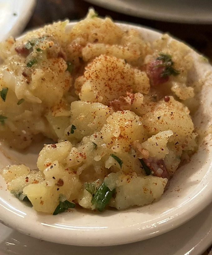 The star of the show: German potato salad that would make your Oma weep with joy. Warm, tangy, and studded with bacon—this isn't your picnic potato salad.