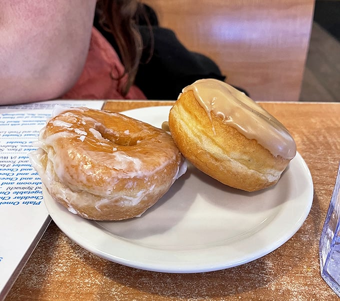 These glazed beauties aren't just donuts – they're edible sunshine with a side of childhood nostalgia. Worth every sticky finger.