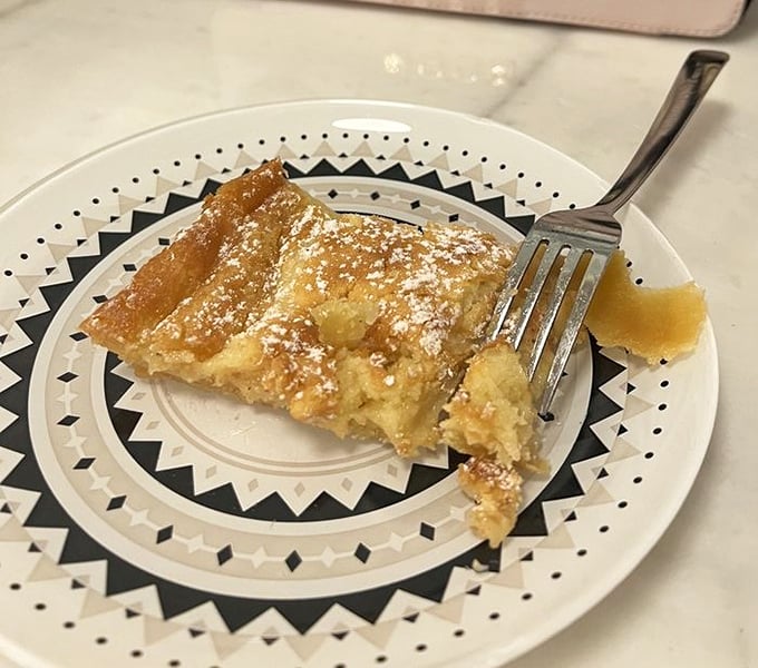 The holy grail of St. Louis desserts – gooey butter cake that's somehow both fluffy and dense, with that perfect dusting of powdered sugar on top.