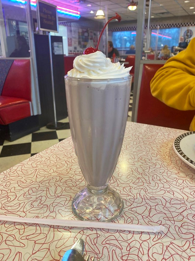 Cloud-like whipped cream crowned with a cherry—this milkshake isn't just thick enough for a spoon, it's practically a national monument to dairy.
