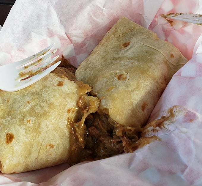 The legendary Green Chili Burrito in its natural habitat – about to disappear. That tortilla is holding more flavor than should be legally possible.