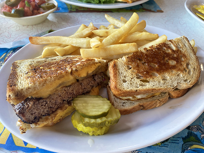 The humble patty melt—where bread meets beef in a cheese-mediated romance that would make Shakespeare write sonnets about grilled sandwiches.