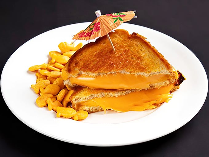 Behold the golden glory that launched a thousand return visits – perfectly toasted bread embracing a molten cheese center that stretches dramatically with each bite.