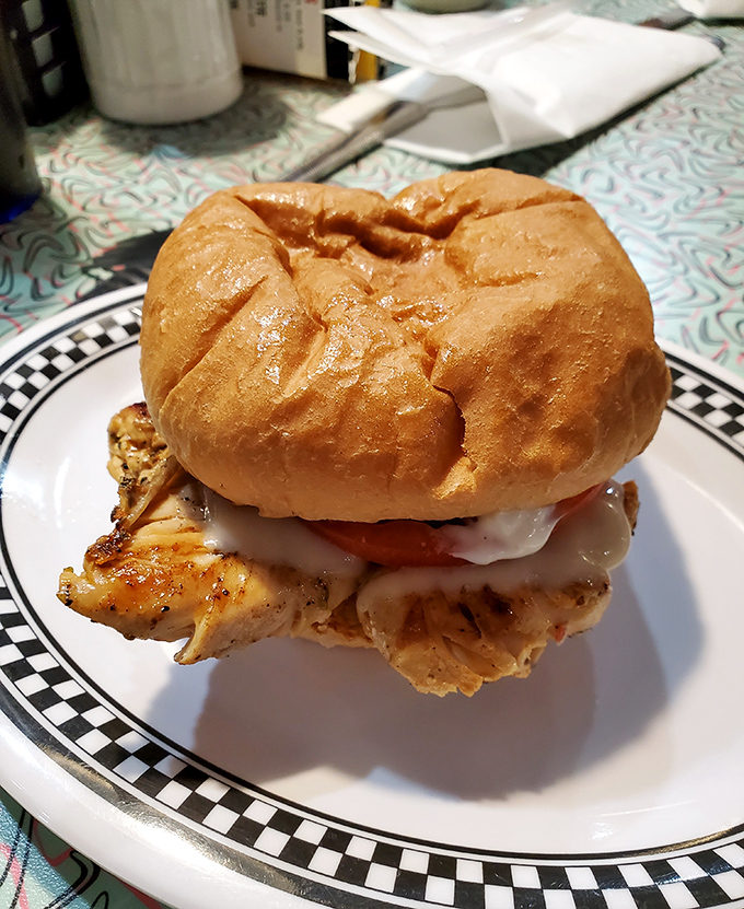 This chicken sandwich isn't playing around—golden, juicy, and stacked so high it needs its own zip code. Worth every napkin you'll need.
