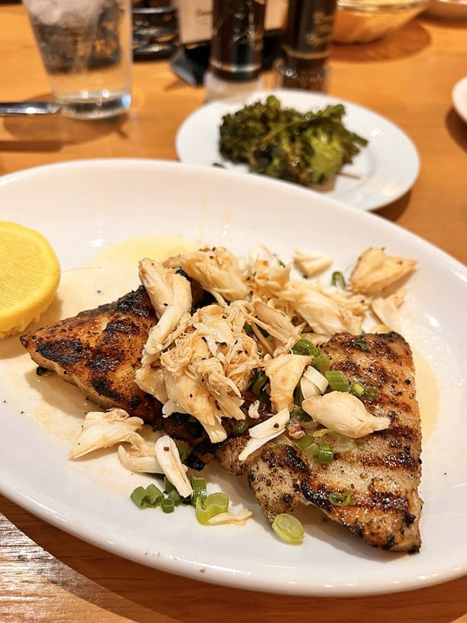 This grilled grouper doesn't just flake at the touch of your fork—it practically serenades you with fresh crab topping and a squeeze of lemon.