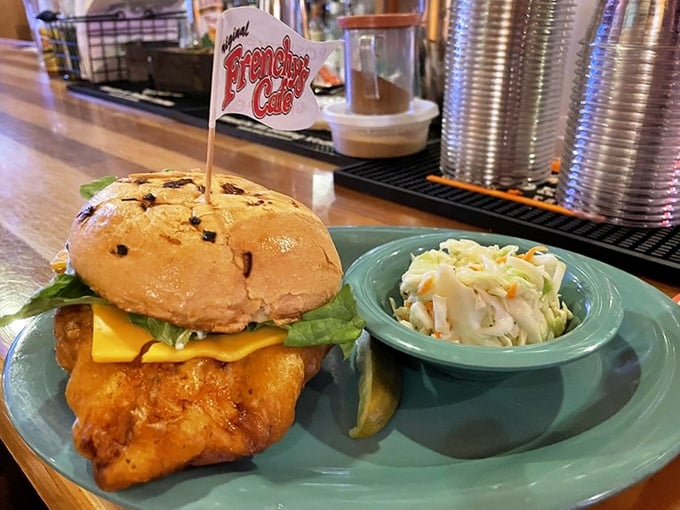 The grouper sandwich arrives looking like it could double as a life preserver – crispy, golden, and absolutely massive.