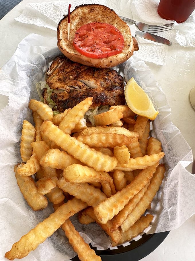 Behold the star of the show—a blackened grouper sandwich that makes you wonder why anyone bothers with fancy dining.