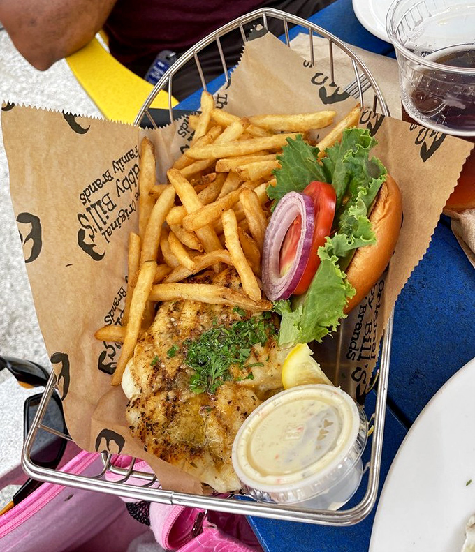 This grilled grouper sandwich doesn't just hang over the edges of the bun—it makes a statement that Florida seafood needs no fancy introduction.