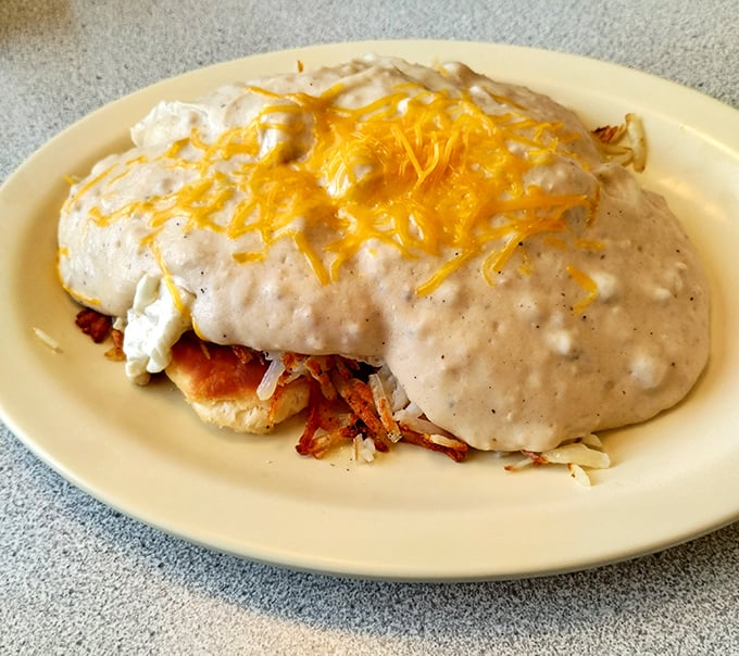 This isn't just breakfast—it's a gravity-defying monument to morning indulgence, where gravy and cheese create a delicious avalanche of flavor.