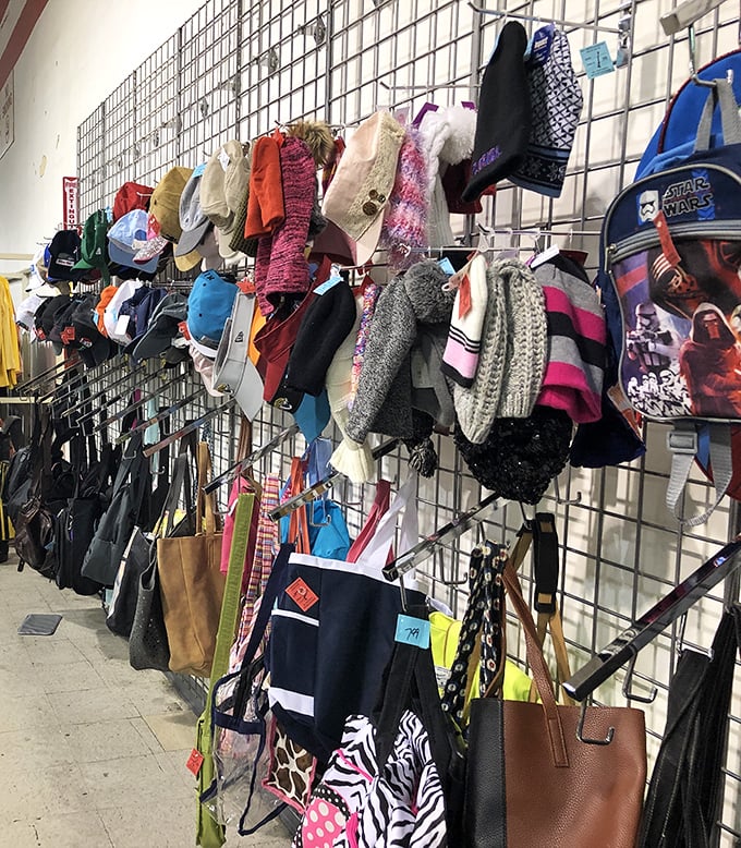 Accessories galore! This wall of possibility transforms yesterday's fashion statements into tomorrow's conversation pieces. Handbag heaven meets hat paradise.