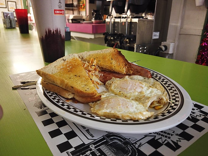 A homestyle breakfast platter featuring two sunny-side-up eggs that look you straight in the eye and say, “Good morning, sunshine!” Paired with golden toast boasting the perfect butter-to-crunch ratio.