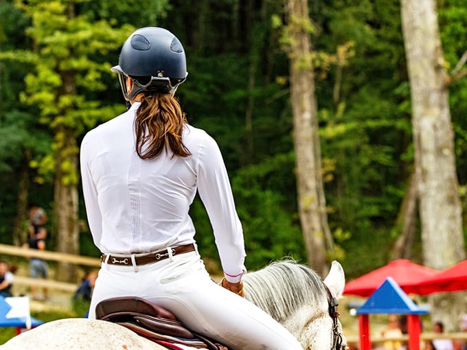 In Aiken, even the riding attire looks like it belongs in a Ralph Lauren catalog—pristine whites against lush forest backdrops.