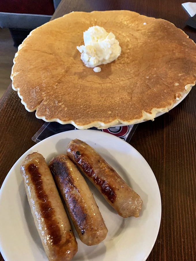 This pancake isn't just big—it's got its own area code. A proper LA breakfast where even the sausages look like they've been working out.