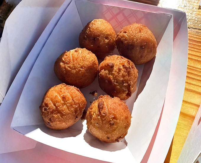 Golden orbs of cornmeal perfection that might make you forget the main course. These hush puppies aren't just sides—they're the main event.