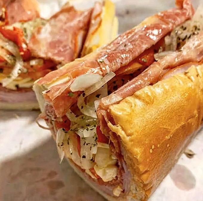 Behold the sandwich that launched this article. Layers of Italian meats and cheese nestled in fresh-baked bread – a masterpiece that would make Michelangelo weep.