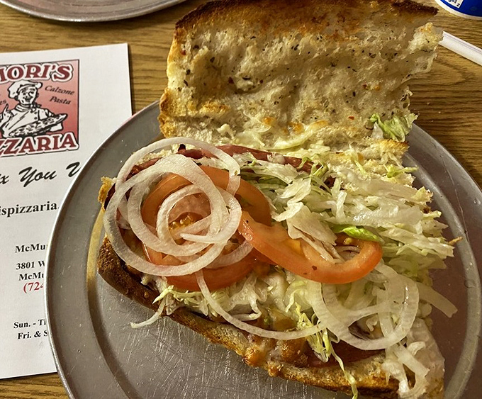 The legendary Italian hoagie—a masterpiece of meat, cheese, and veggies that makes you understand why some people plan road trips around sandwiches.