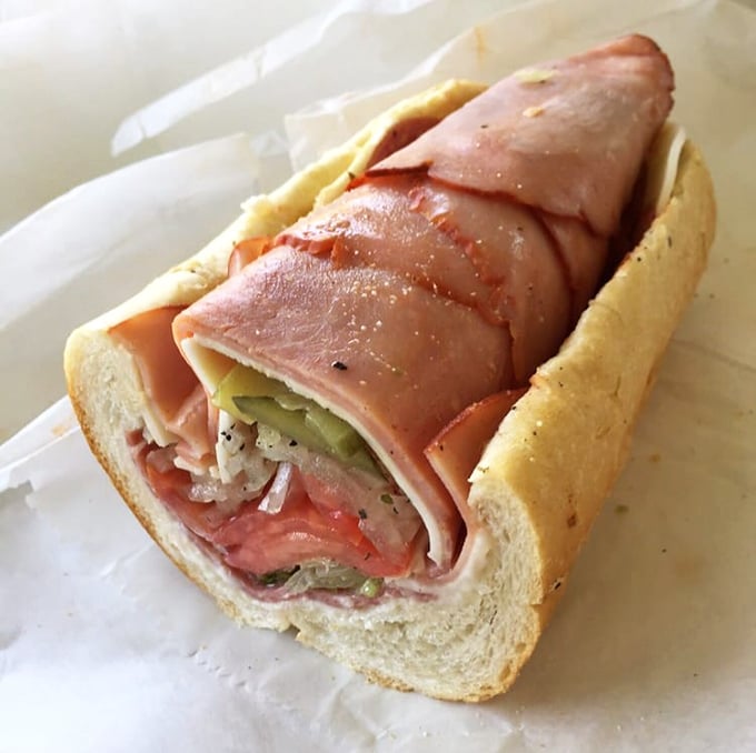 Layer upon glorious layer of Italian meats and fresh veggies—this isn't just a sandwich, it's architecture you can eat.