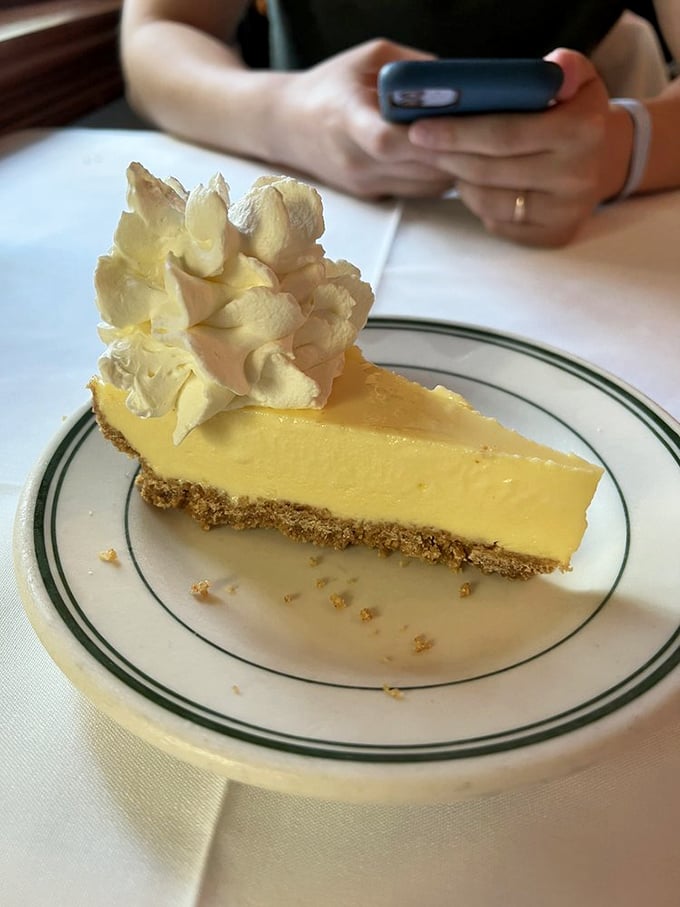 The key lime pie arrives like Florida sunshine on a plate—tart, sweet, with a perfect graham cracker foundation that would make architects jealous.