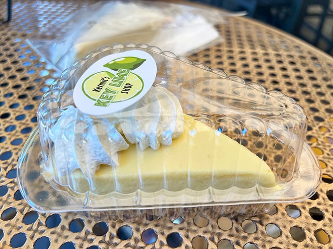 A slice of authentic key lime pie in its natural habitat—pale yellow, not green, because real key limes know better than to wear costume jewelry to a formal event.