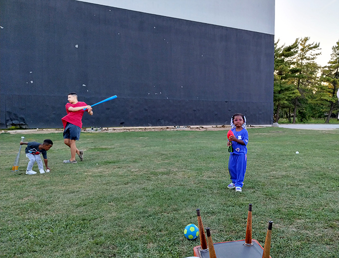 Pre-show playground antics by the big screen – where kids burn energy before settling in for Hollywood magic.