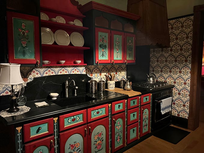 The kitchen's folk art cabinetry and patterned wallpaper offer a colorful contrast to the castle's somber reputation—even ghosts appreciate good design.