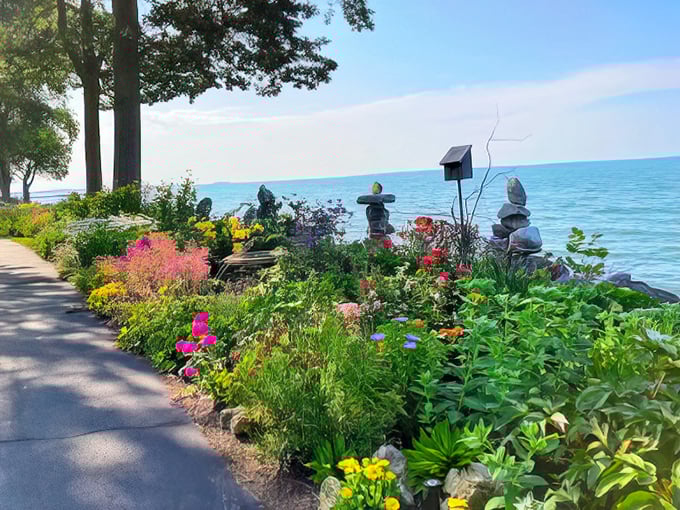 Nature's own lakeside garden—where colorful blooms and carefully balanced stone sculptures create a meditation space that no spa could ever replicate.