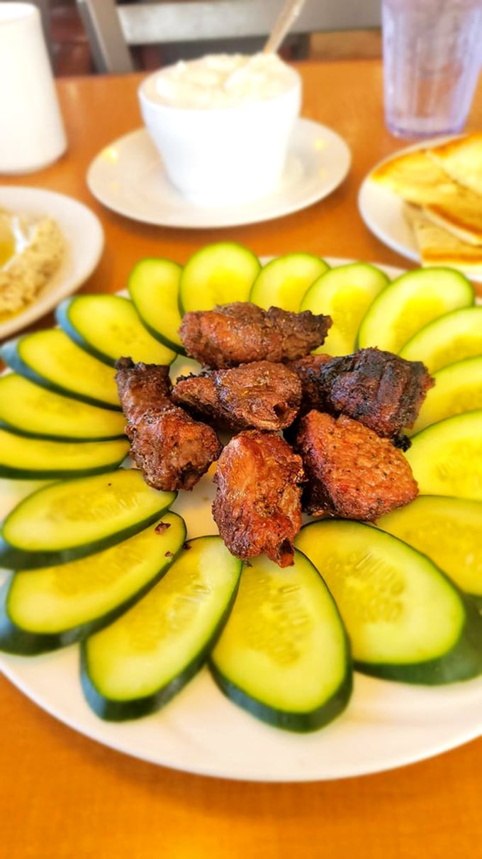 These savory lamb morsels surrounded by cucumber slices aren't just appetizers—they're tiny flavor bombs that make waiting for the main course a pleasure, not a chore.
