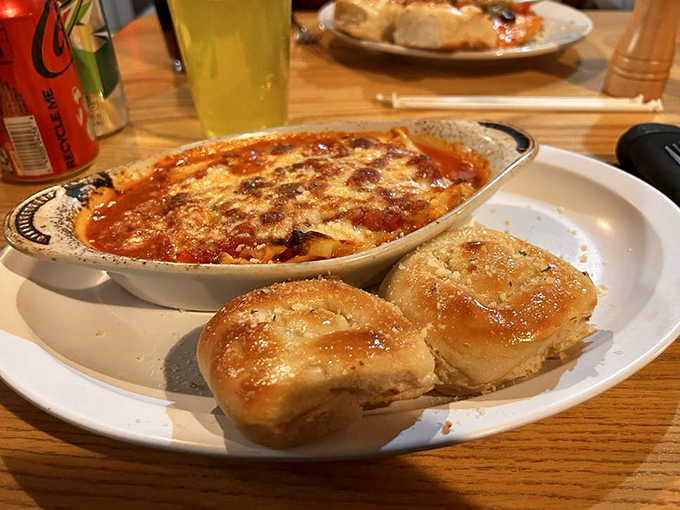Behold the bubbling masterpiece that launched a thousand return visits—layers of pasta, cheese, and sauce that would make any Italian grandmother nod in silent approval.