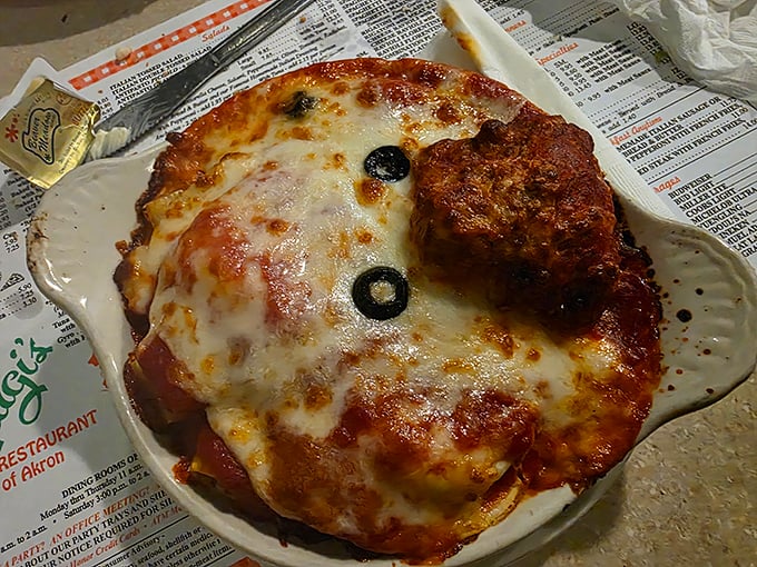 Behold the lasagna that launched a thousand road trips—a bubbling cauldron of cheese, sauce, and pasta that makes grown adults weep with joy.