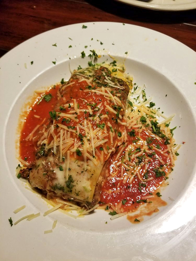 Lasagna that doesn't just sit on the plate—it poses for it. Those layers of pasta, cheese, and sauce are performing an Italian opera for your taste buds.