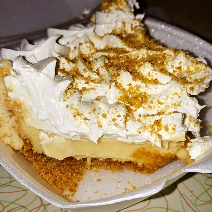The legendary lemon pie arrives with a cloud of meringue so perfect it makes you wonder if angels moonlight as pastry chefs.