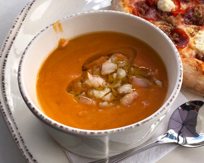 This isn't just lobster bisque—it's liquid gold in a bowl, topped with tender morsels of lobster that make you wonder why you'd ever order anything else.