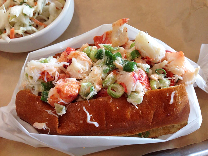 The lobster roll that launched a thousand road trips. Chunks of sweet meat nestled in a buttery roll—Maine's greatest export reimagined in Georgia.