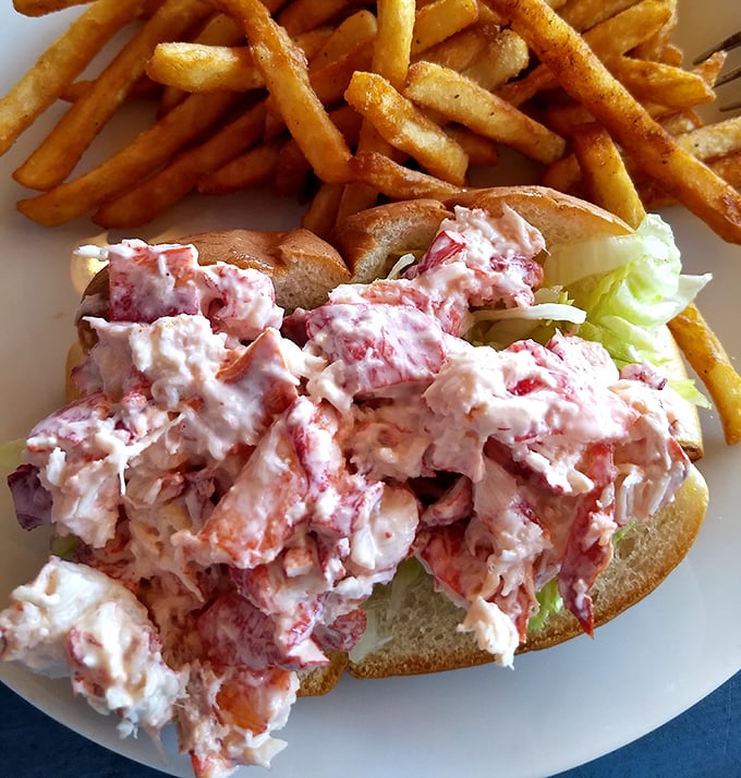 This isn't just a lobster roll—it's summer vacation transformed into a sandwich. Maine lobster chunks practically high-fiving the mayo.