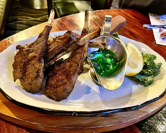 These lollipop lamb chops aren't just meat on sticks—they're primal satisfaction with a touch of elegance. The mint jelly adds that perfect sweet counterpoint to the savory richness.