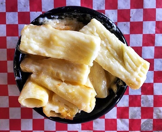Behold the star attraction – mac and cheese that achieves the seemingly impossible balance between creamy and stringy. This isn't a side dish; it's the main event.