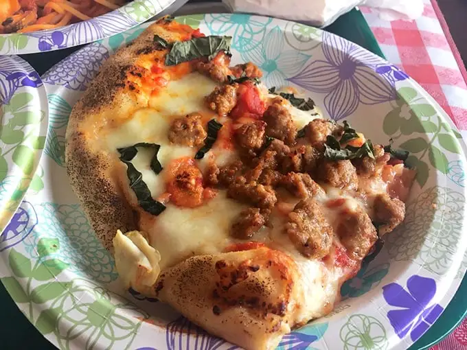 This isn't just pizza—it's edible poetry. The sausage-topped pie features that perfect balance of crisp crust, tangy sauce, and melted cheese.
