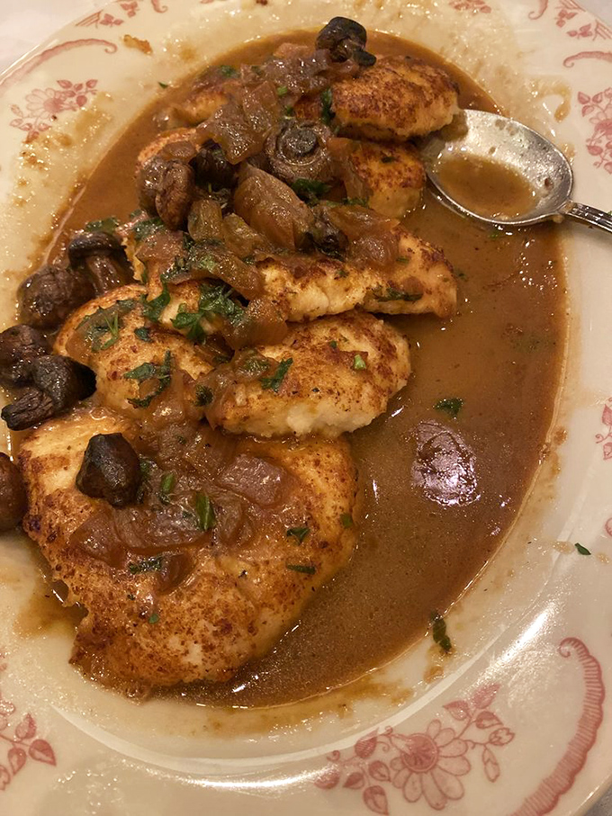 Chicken Marsala that would make your Italian grandmother weep with joy – golden cutlets swimming in a mushroom-studded sauce that demands to be sopped up.