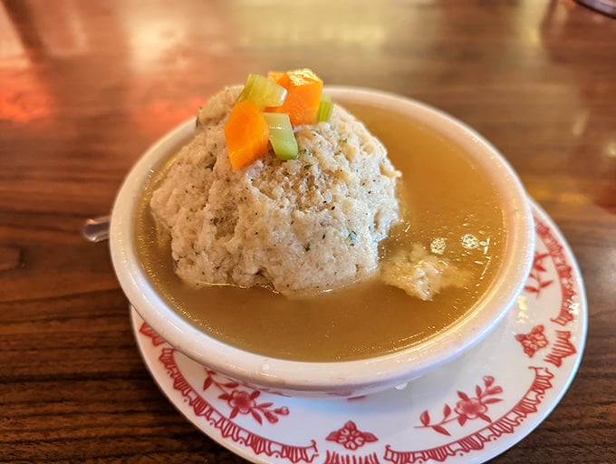 The matzo ball soup – where a fluffy dumpling island floats in a sea of golden broth. Grandmothers everywhere would give this their reluctant approval.