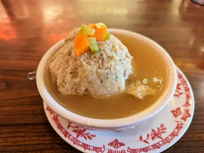 The matzo ball soup – where a fluffy dumpling island floats in a sea of golden broth. Grandmothers everywhere would give this their reluctant approval.