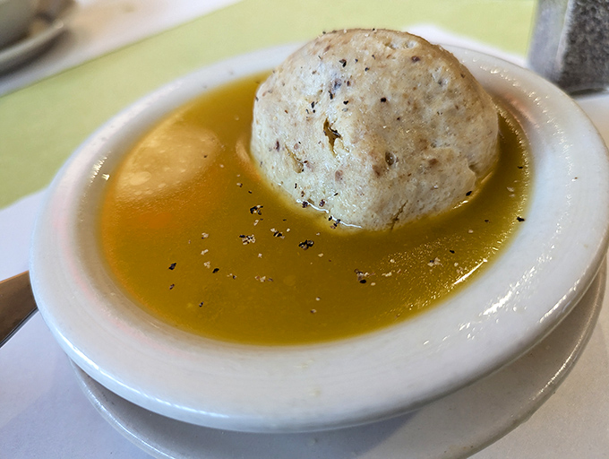 The matzo ball soup at Jack's floats like a cloud in golden broth – chicken soup for the soul that actually deserves the title.