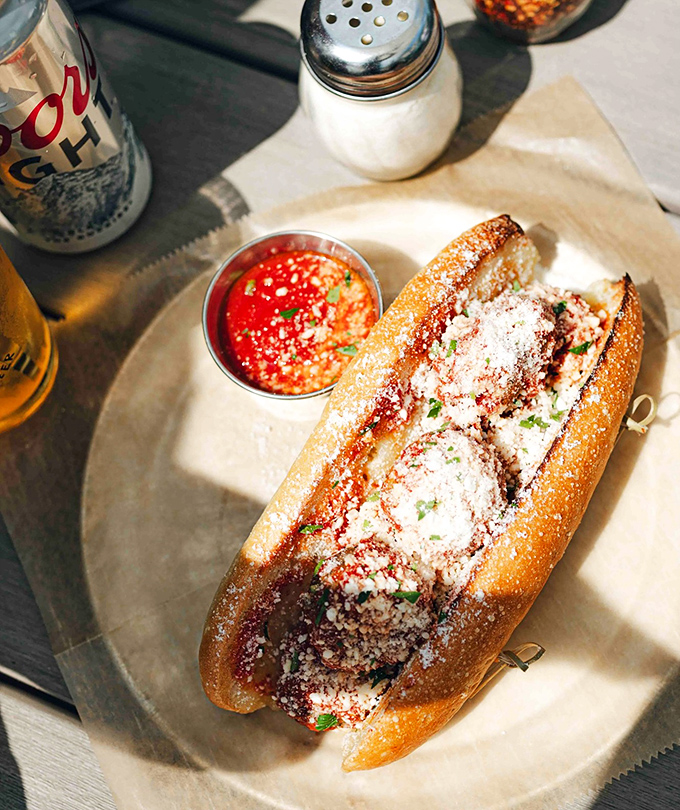 This meatball sub isn't just a sandwich—it's an architectural marvel of crusty bread, savory meatballs, and that sauce that demands to be sopped up with every last crumb.